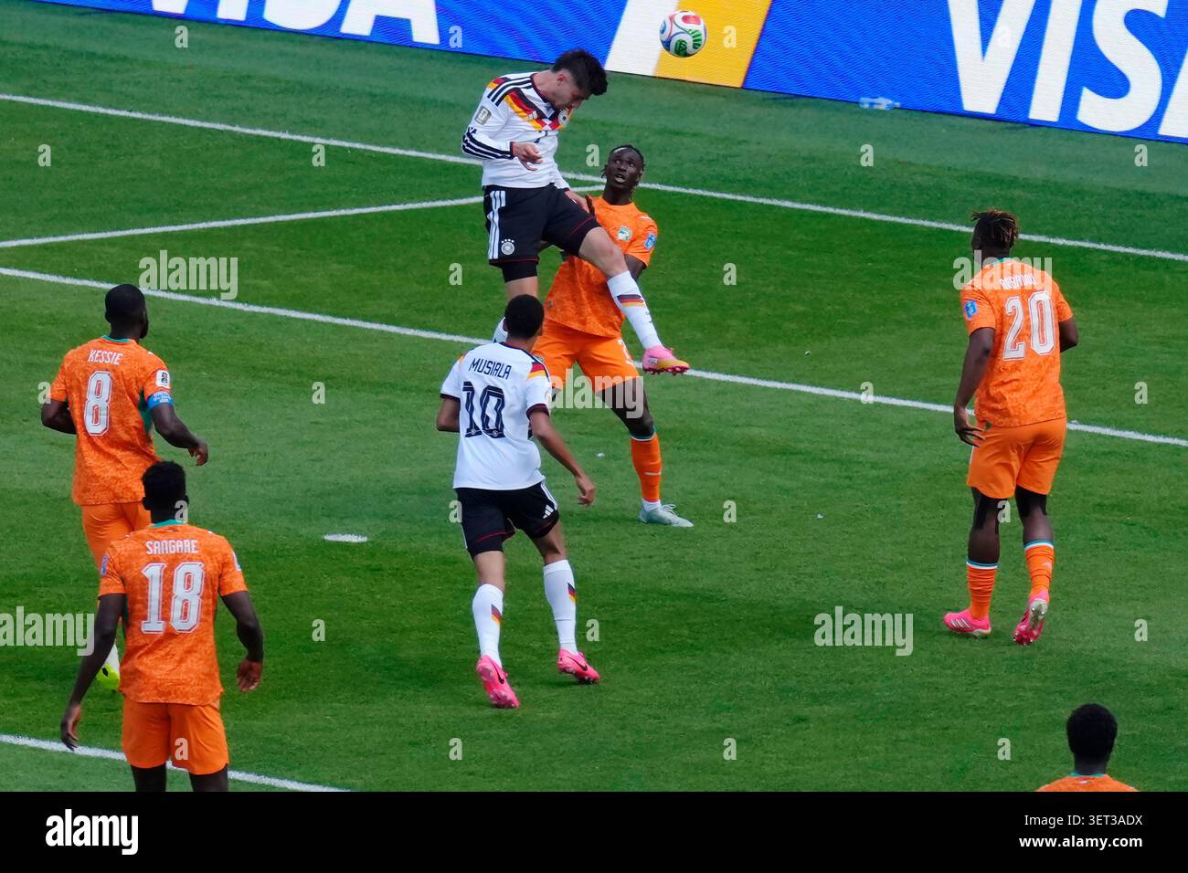 Germany's Kai Havertz (top) heads a ball over Ivory Coast's Odilon ...