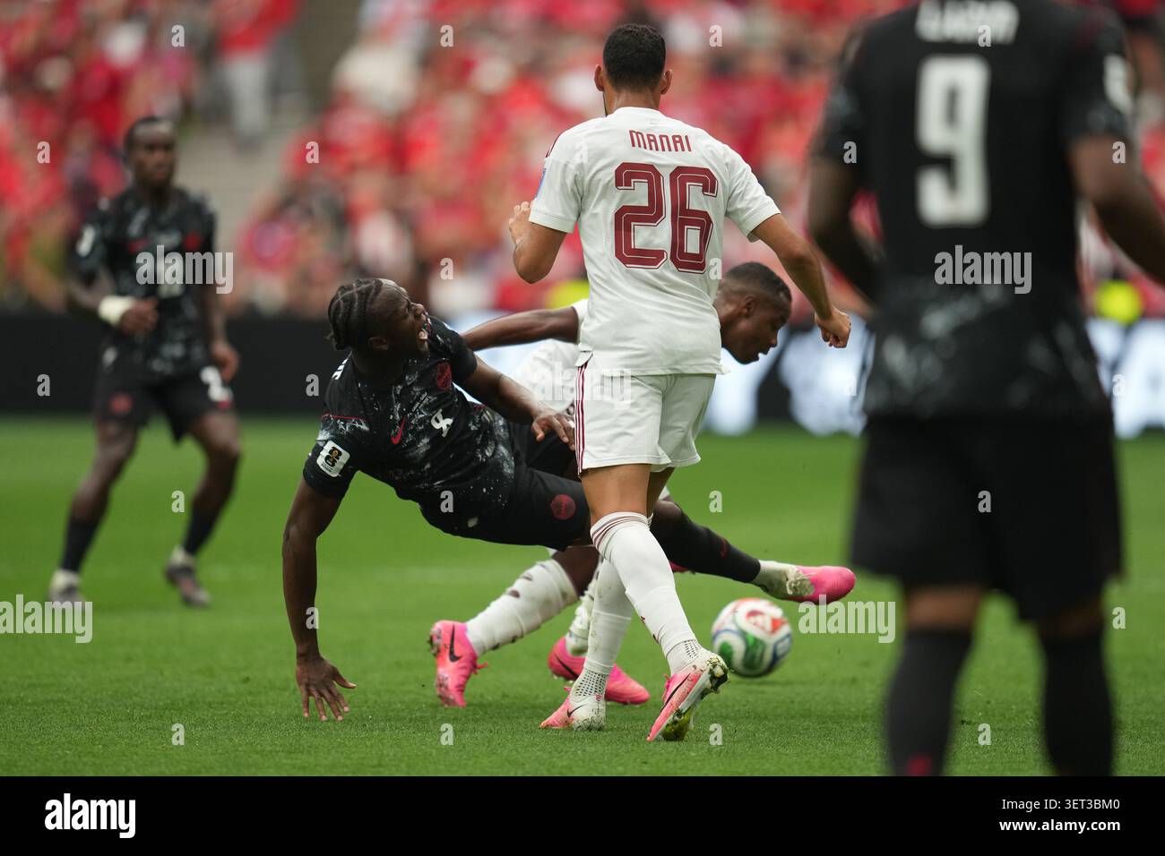 Canada's Ismael Kone, left, falls while being fouled against by Qatar's ...