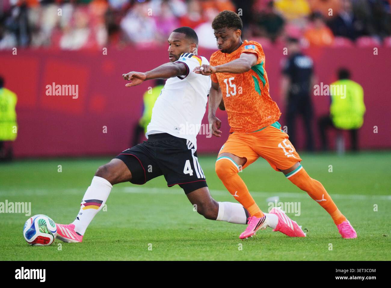 Germany's Jonathan Tah (4) and Ivory Coast's Amad Diallo (15) battle ...