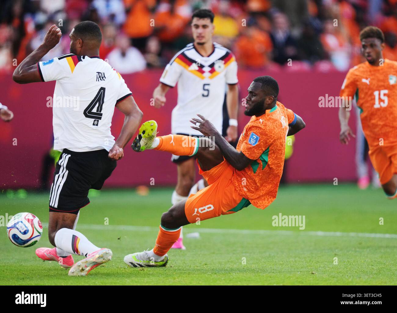Ivory Coast's Franck Kessie (8) shoots past Germany's Jonathan Tah (4 ...
