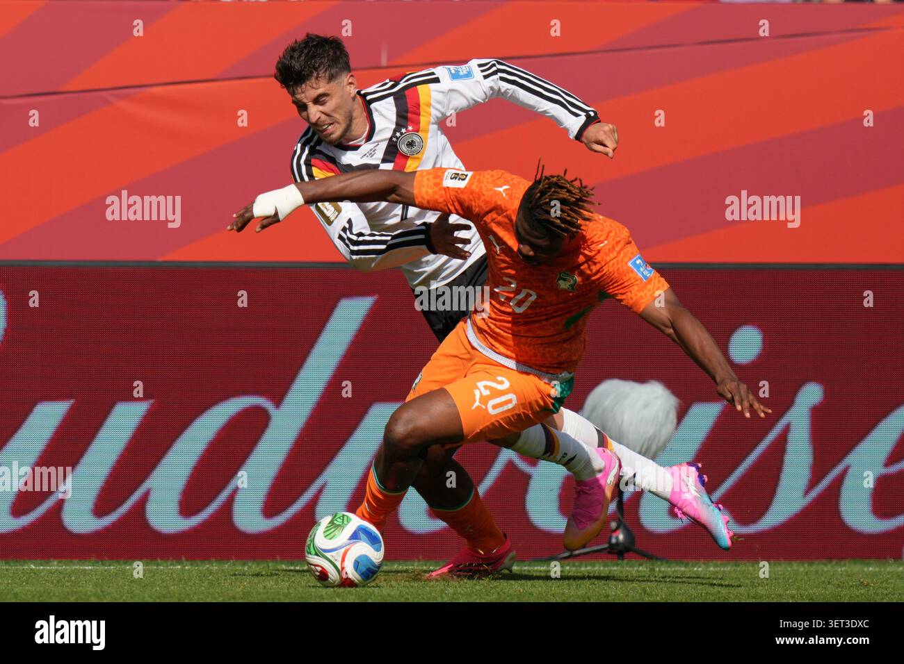 Germany's Kai Havertz, left, falls as he is tackled by Ivory Coast's ...