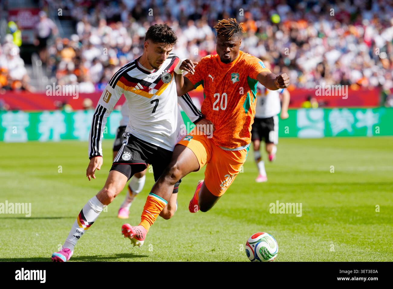 Germany's Kai Havertz (7) and Ivory Coast's Emmanuel Agbadou (20) vie ...