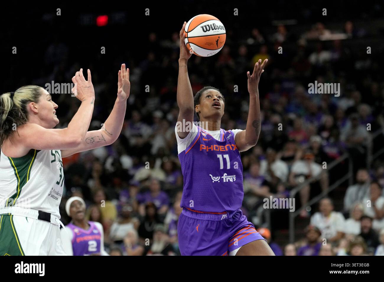 Phoenix Mercury forward Valeriane Ayayi (11) drives past Seattle Storm ...