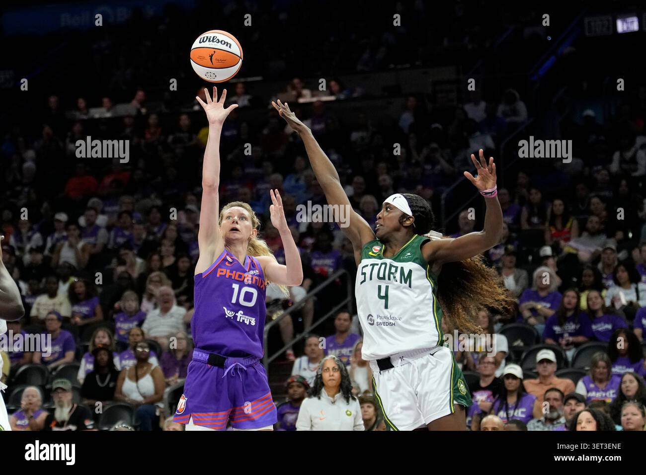Phoenix Mercury guard Lexi Held (10) shoots over Seattle Storm guard ...