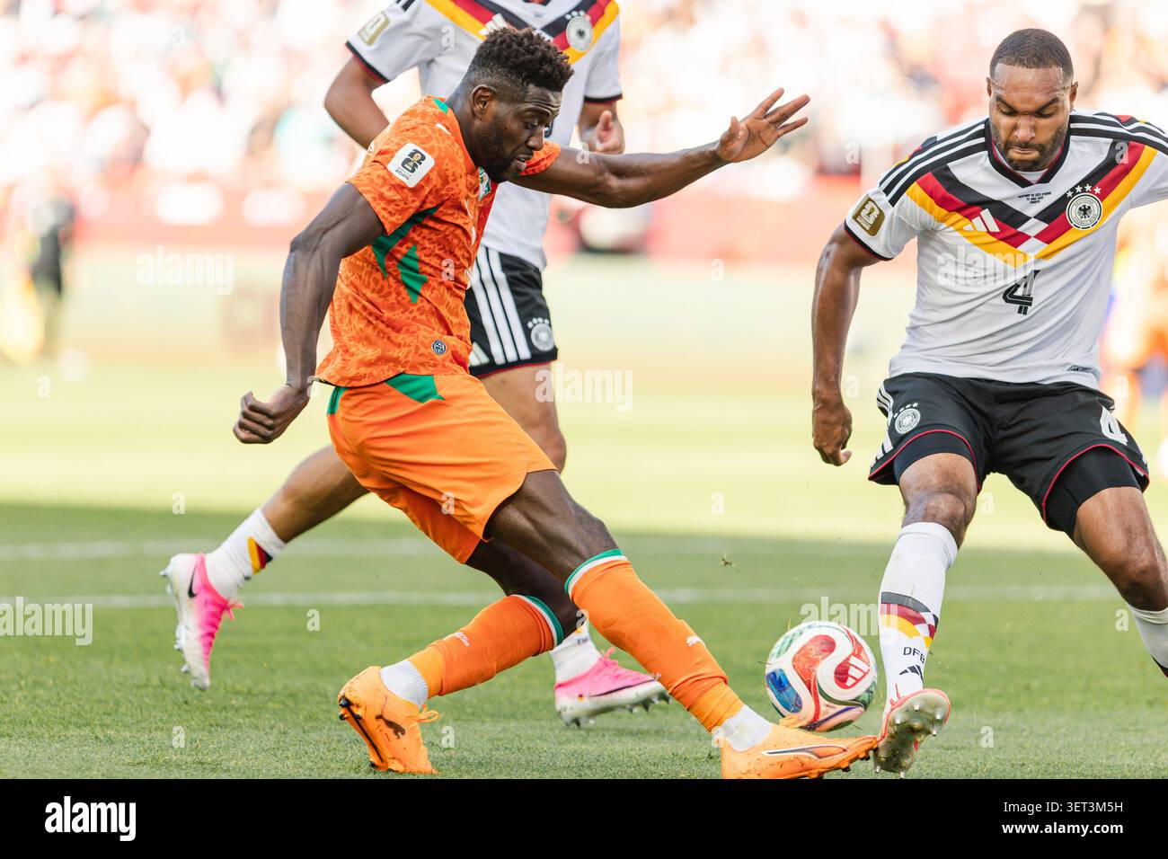 Ange-Yoan Bonny of Ivory Coast contests with Jonathan Tah of Germany ...
