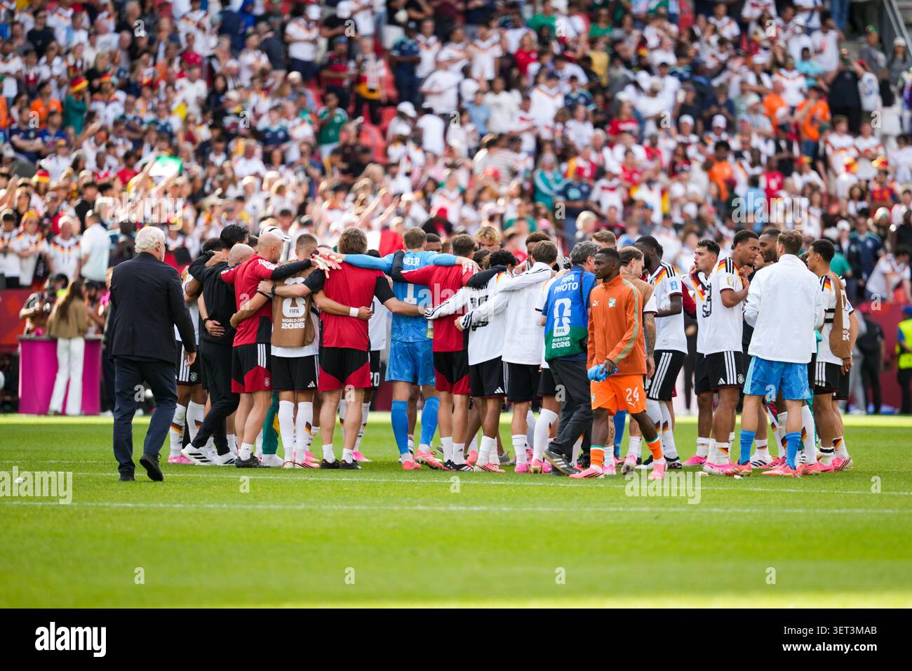 The Germany team gathers to celebrate a win over Ivory Coast during a ...
