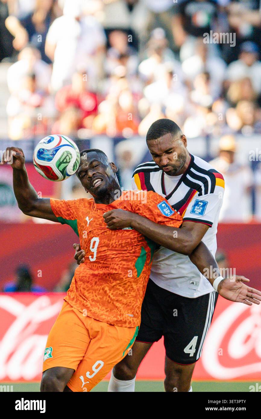 Ange-Yoan Bonny of Ivory Coast contests a header with Jonathan Tah of ...