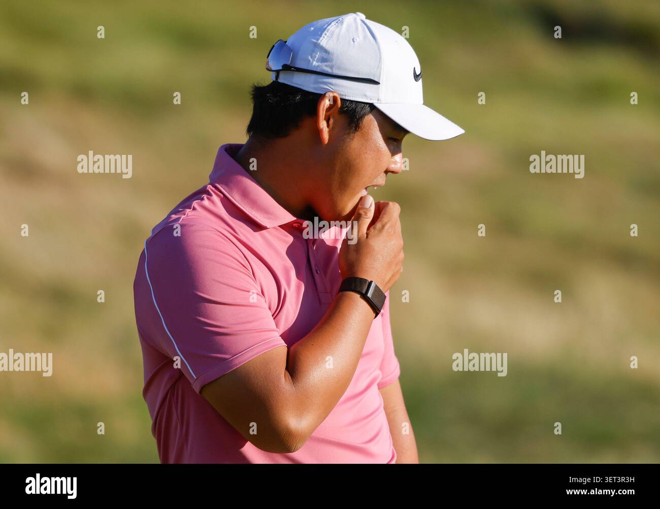 Tom Kim of South Korea prepares to putt on the 14th green during the ...
