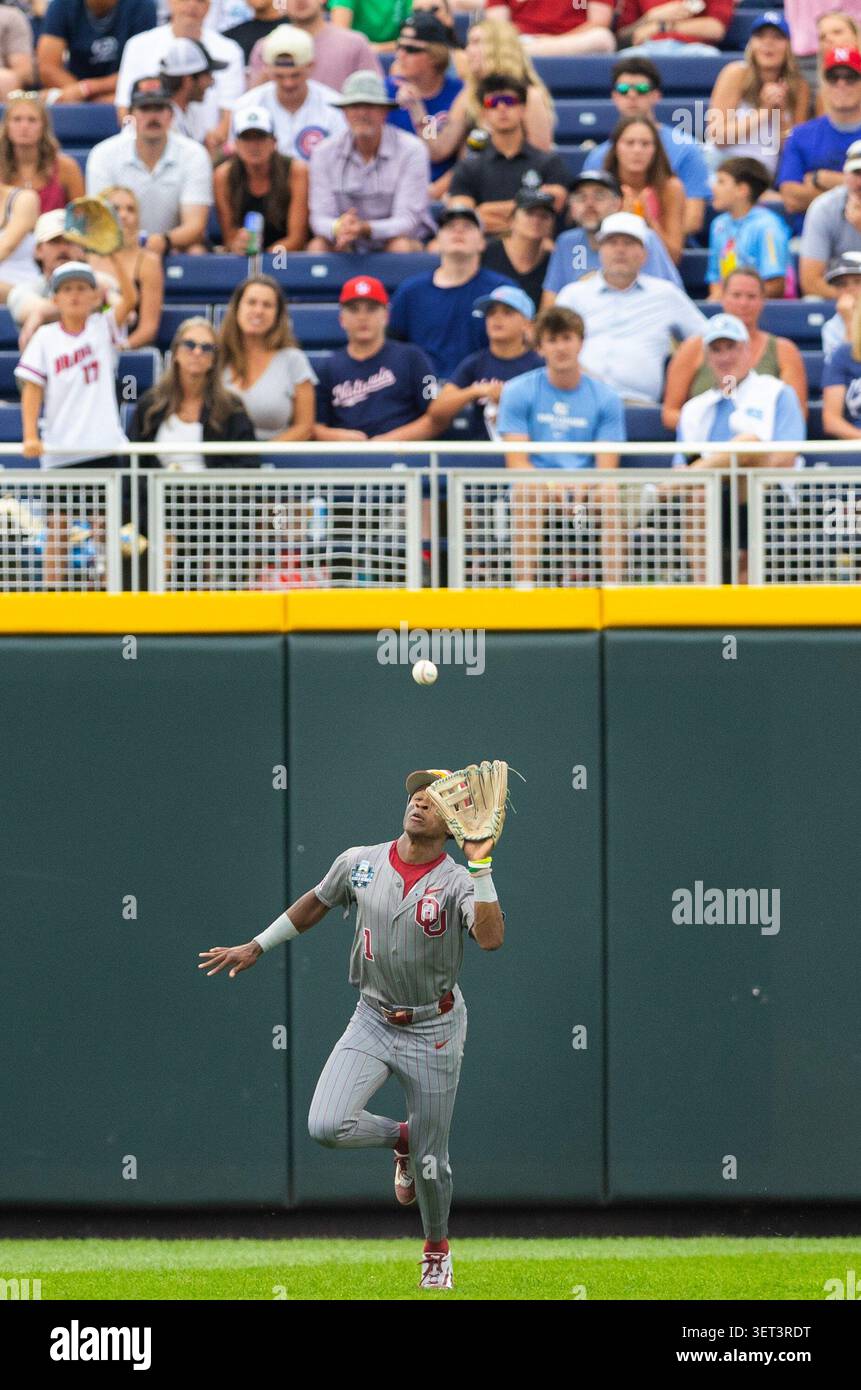 Oklahoma's Jason Walk catches a fly ball hit by North Carolina's Tyler ...