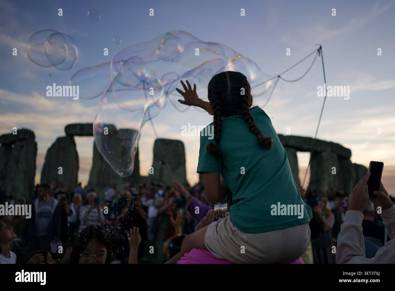 Revelers gather at the ancient stone circle Stonehenge to celebrate the ...