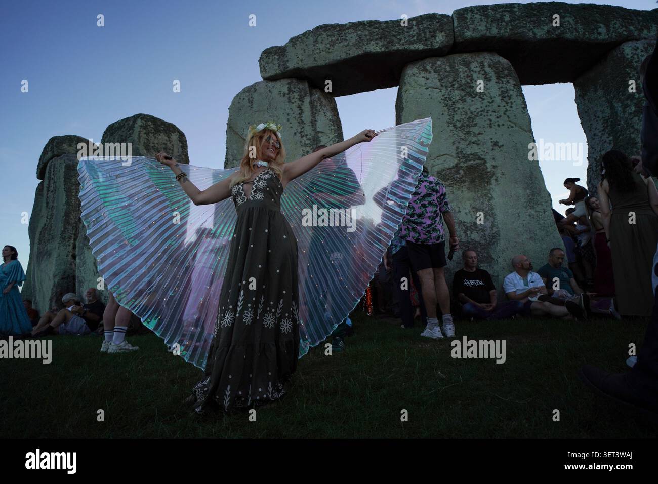Revelers gather at the ancient stone circle Stonehenge to celebrate the ...