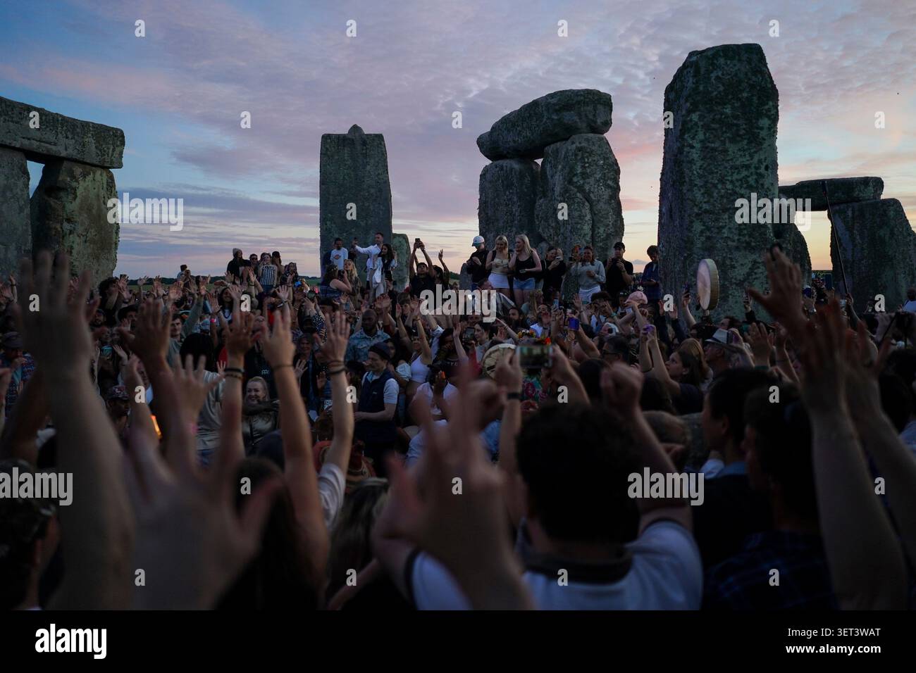 Revelers gather at the ancient stone circle Stonehenge to celebrate the ...