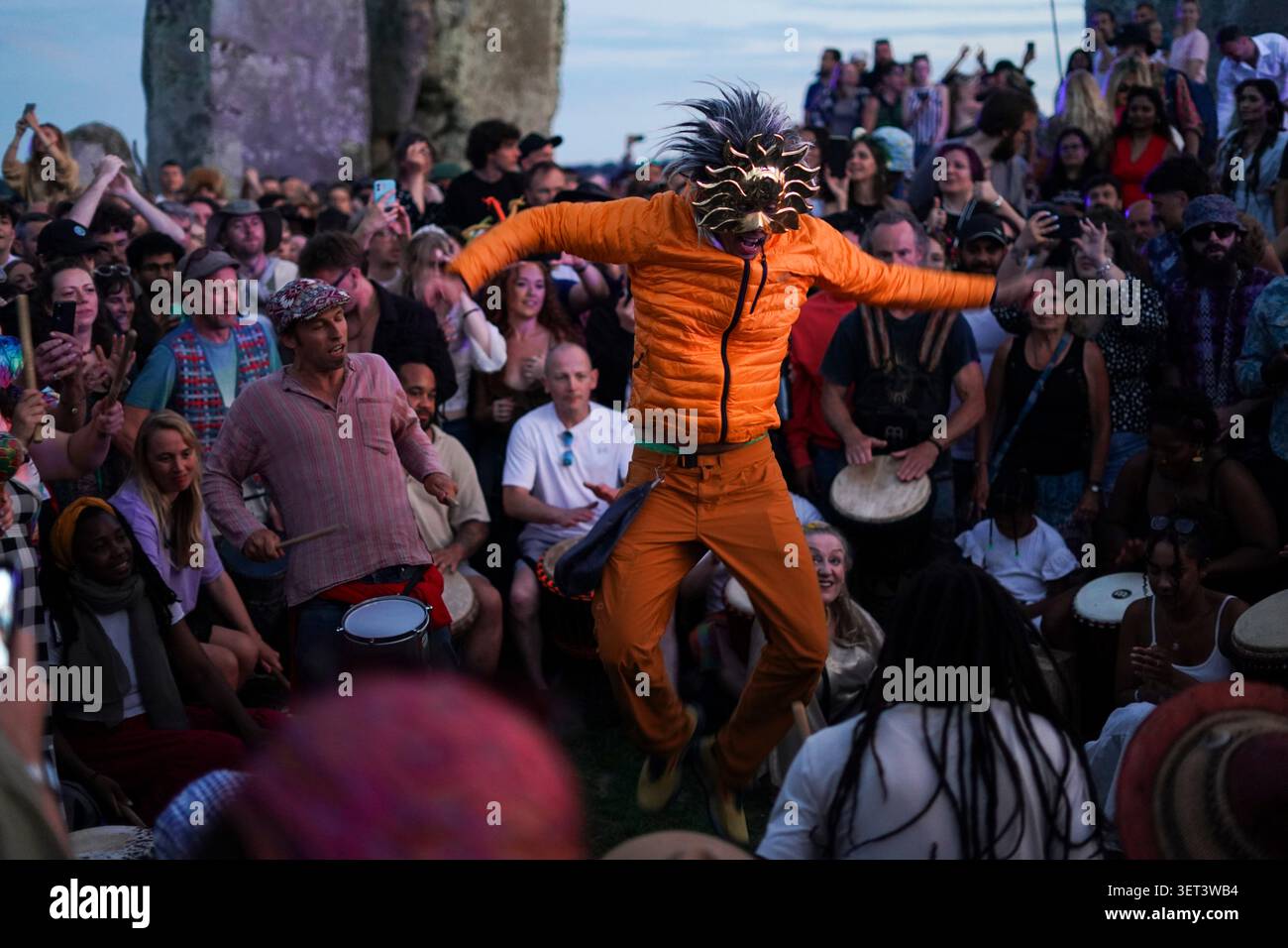 Revelers gather at the ancient stone circle Stonehenge to celebrate the ...