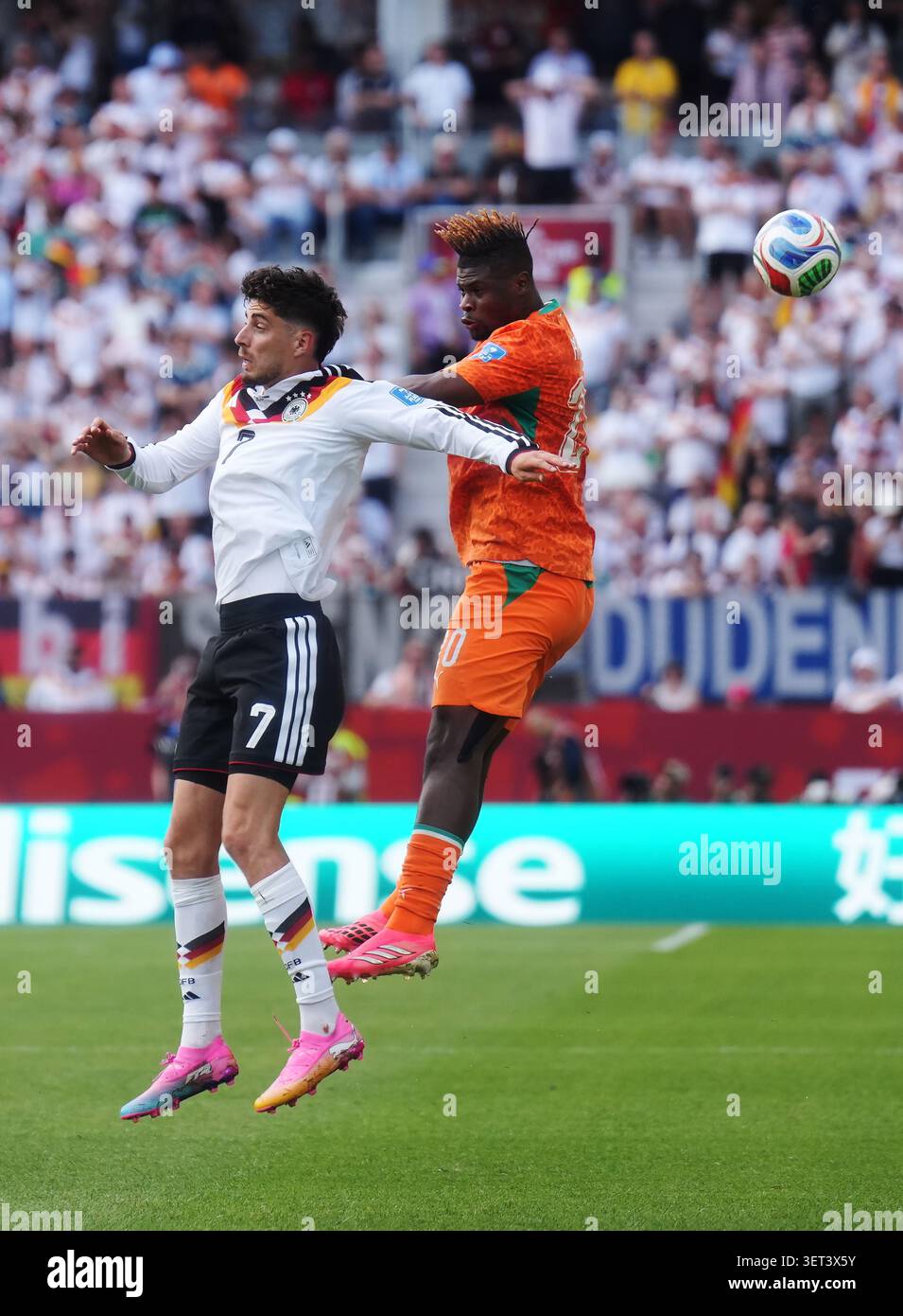 Germany's Kai Havertz (7) and Ivory Coast's Emmanuel Agbadou (20) vie ...