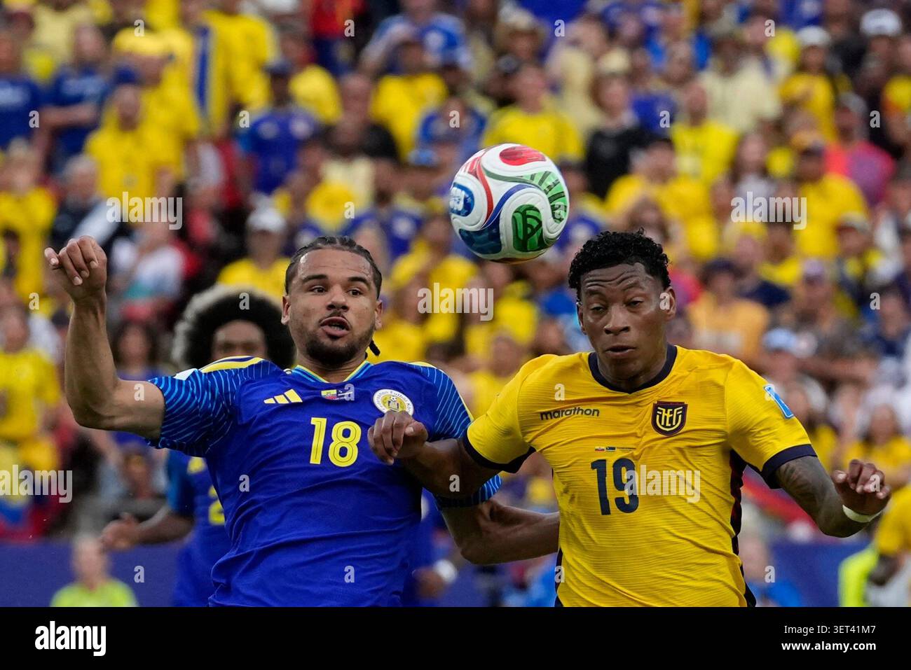 Curaçao's Armando Obispo, left, and Ecuador's Gonzalo Plata battle for ...