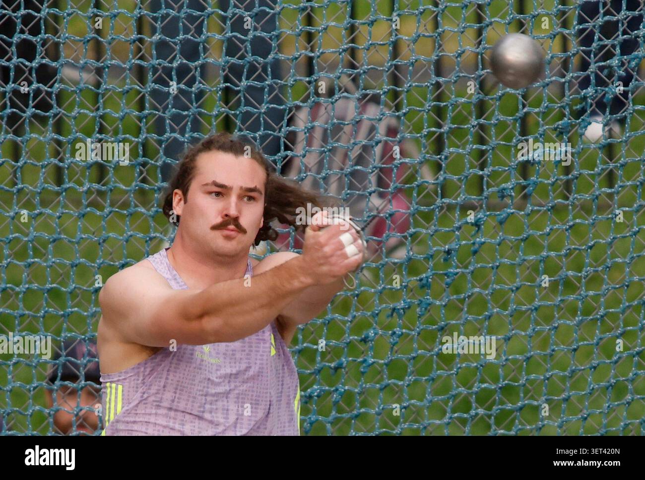 Ethan Katzberg competes in the senior men's hammer throw final during ...