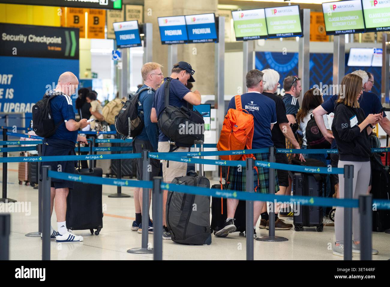 Scotland fans queue for their flight in Boston Logan International ...