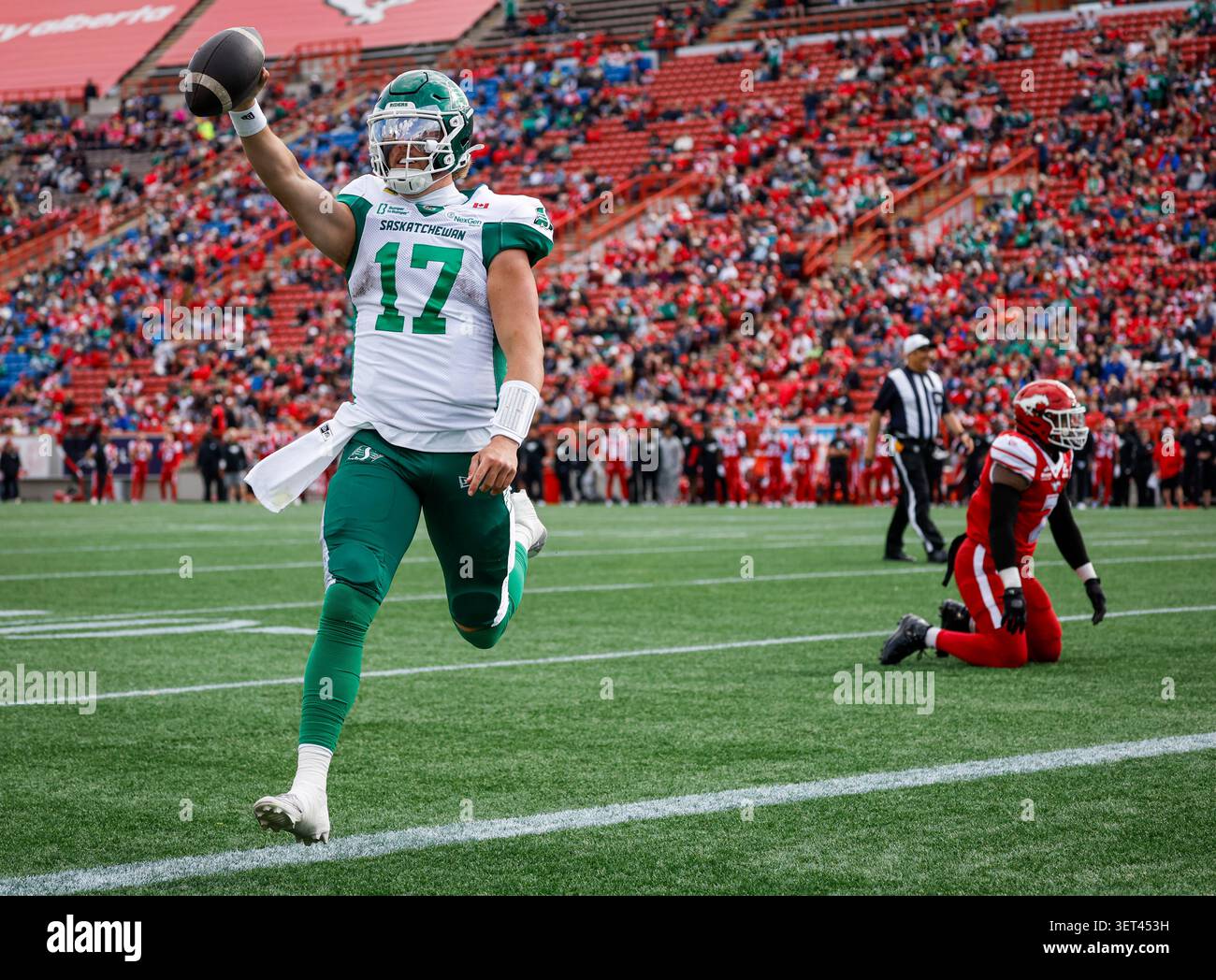 Saskatchewan Roughriders quarterback Tommy Stevens, left, runs in a ...