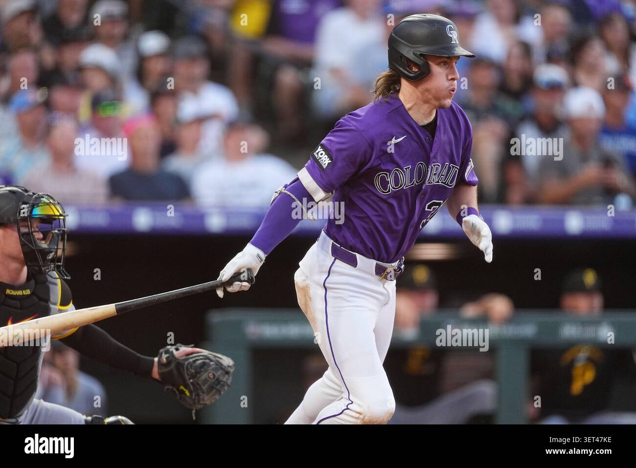 Colorado Rockies' Jake McCarthy breaks from the batter's box on his way ...