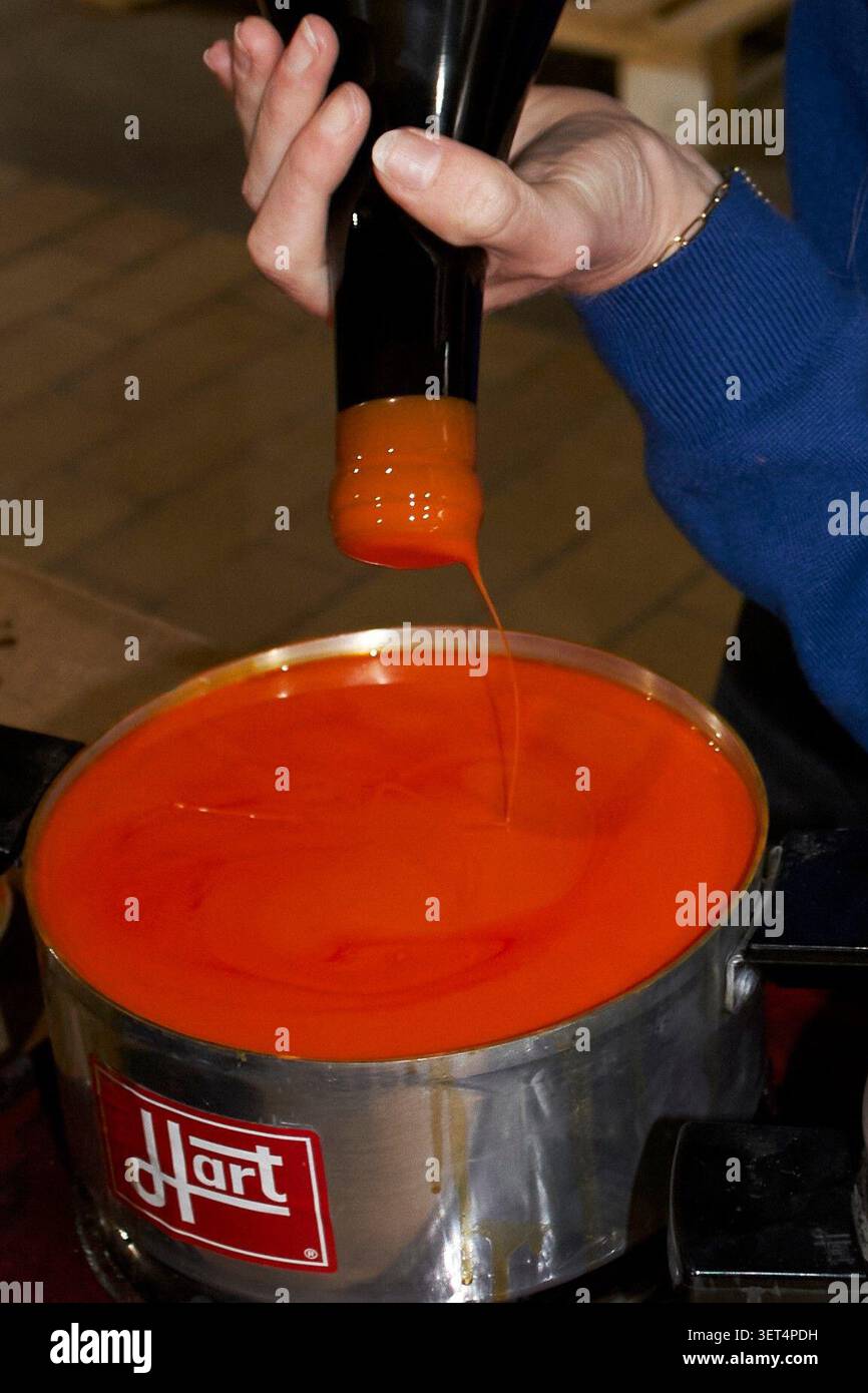 Natasha Jacka applies wax to wine bottles in Cape Town, South Africa ...