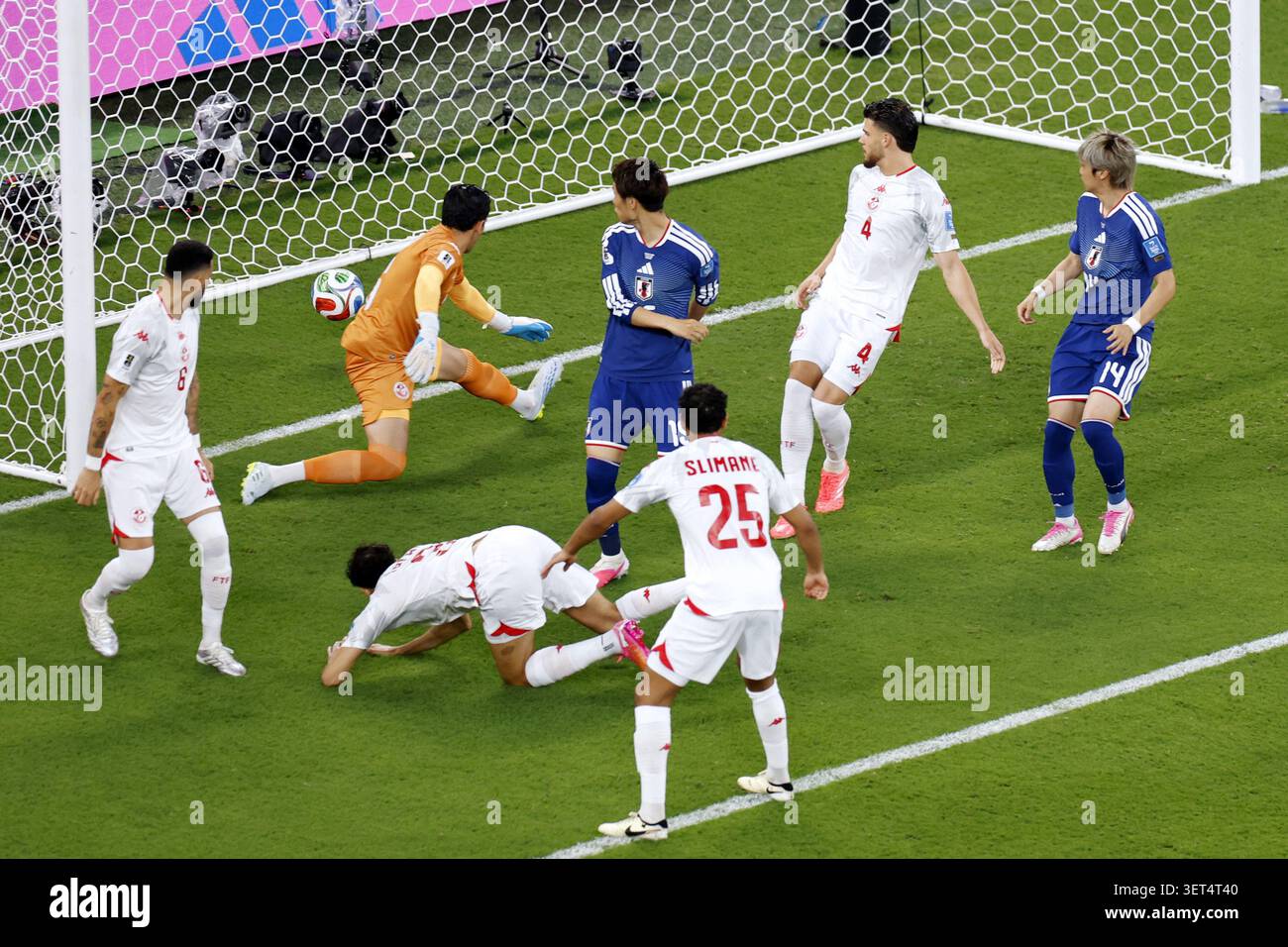Japan's Daichi Kamada (back, 3rd from L) scores the opening goal in the ...