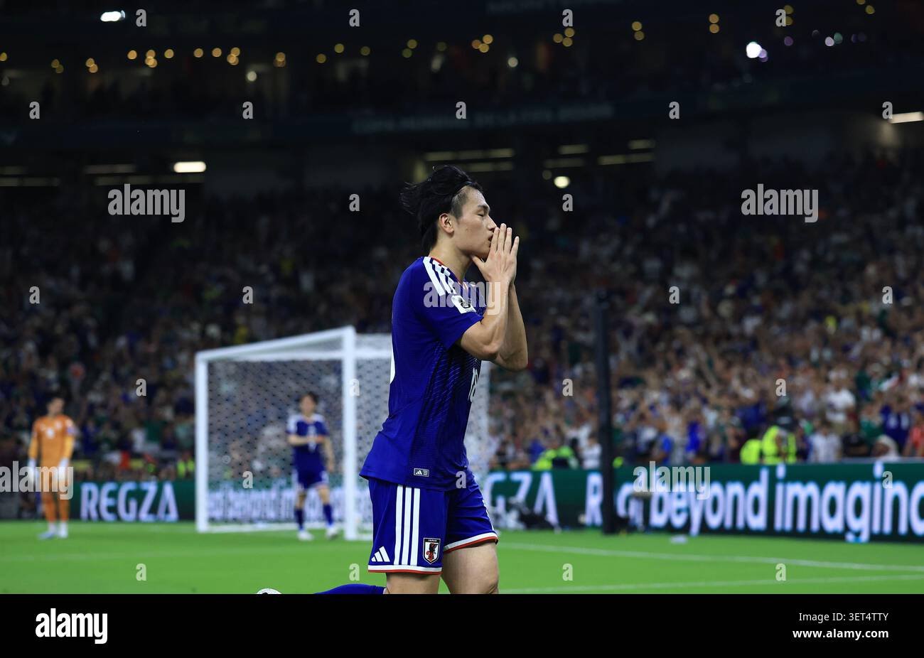 Ayase Ueda (18) of Japan reacts after scoring in the first half of 2026 ...