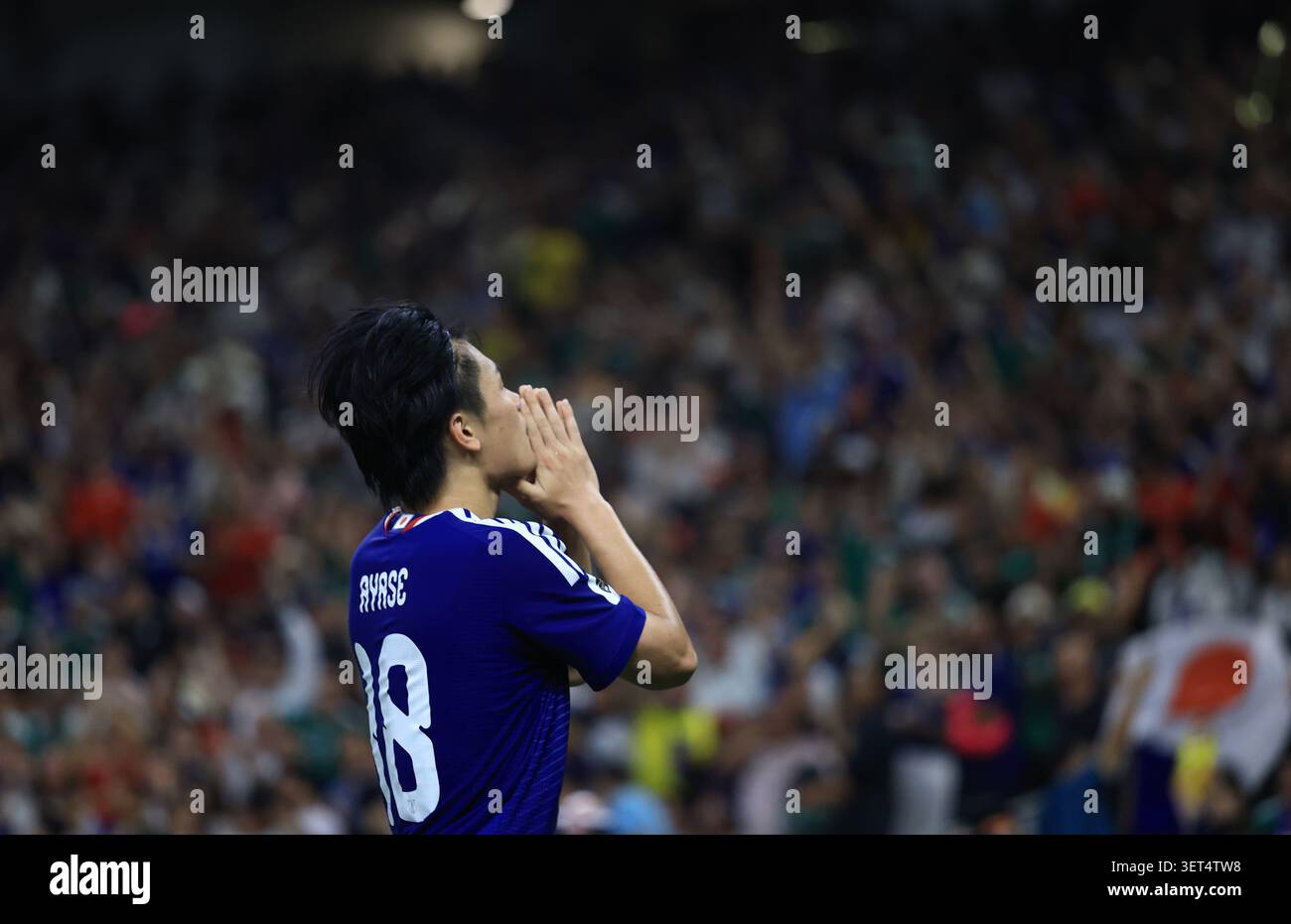 Ayase Ueda (18) of Japan reacts after scoring in the first half of 2026 ...