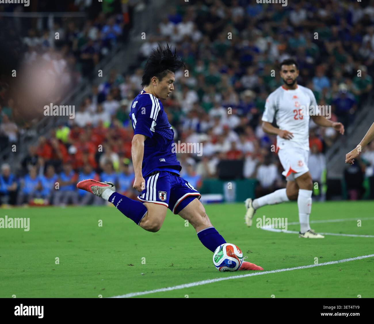 Ayase Ueda (18) of Japan scores in the first half of 2026 FIFA World ...