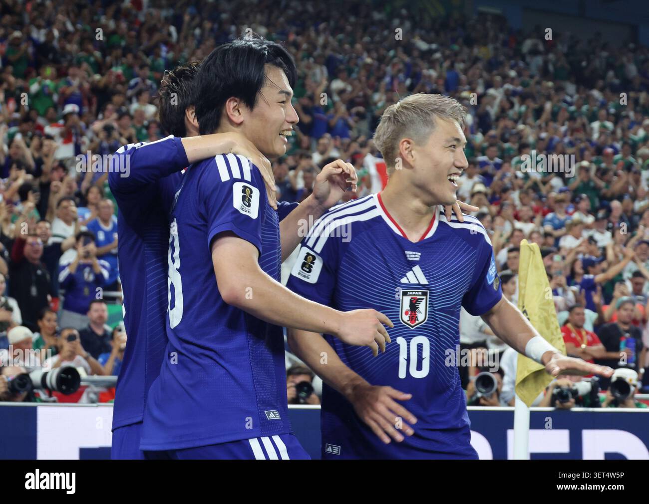 Ayase Ueda (18) of Japan reacts after scoring in the first half of 2026 ...