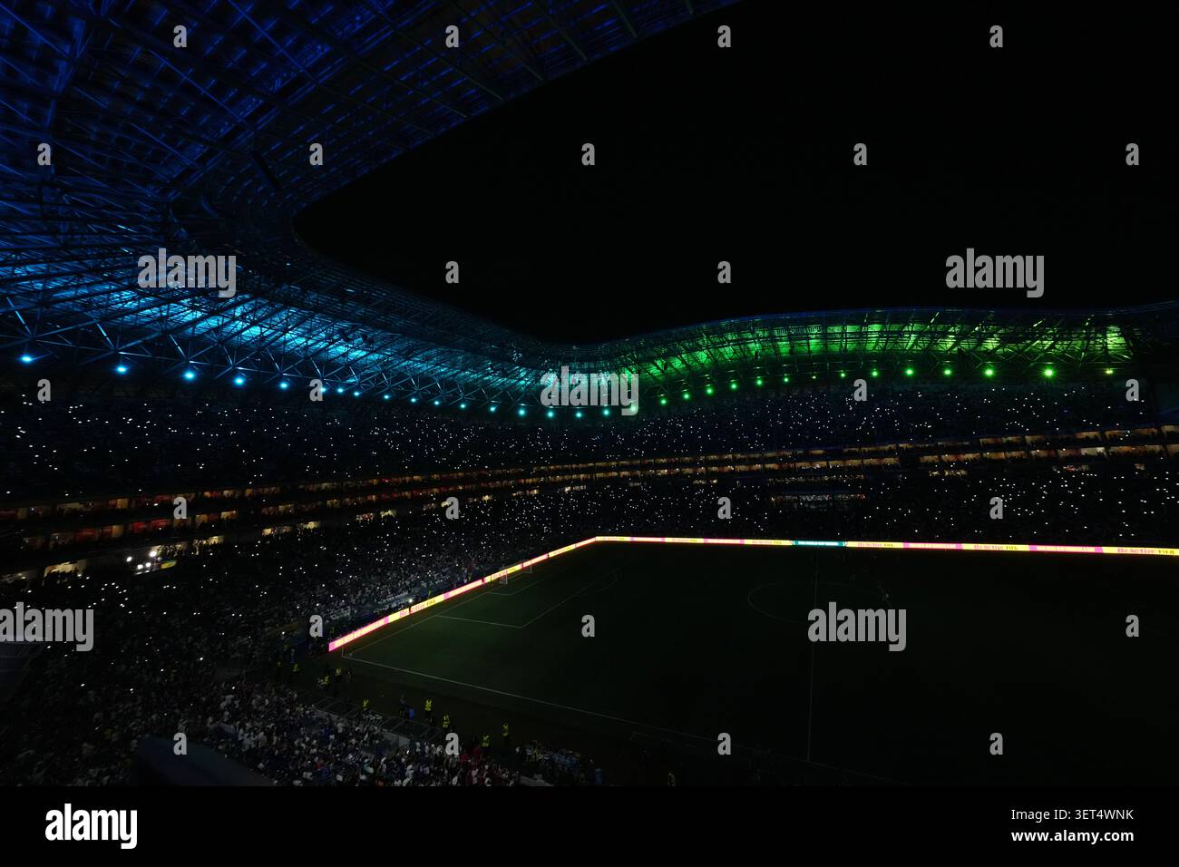 Spectators put on the lights of their phones during the half time of ...