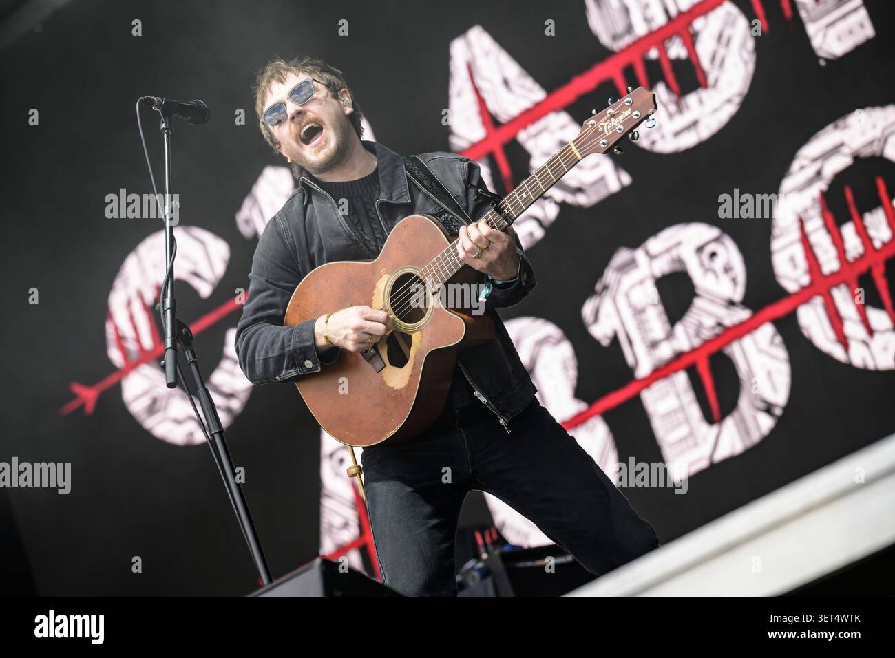 Jonathan Byrne of Chasing Abbey performs live on stage at Glasgow Green ...