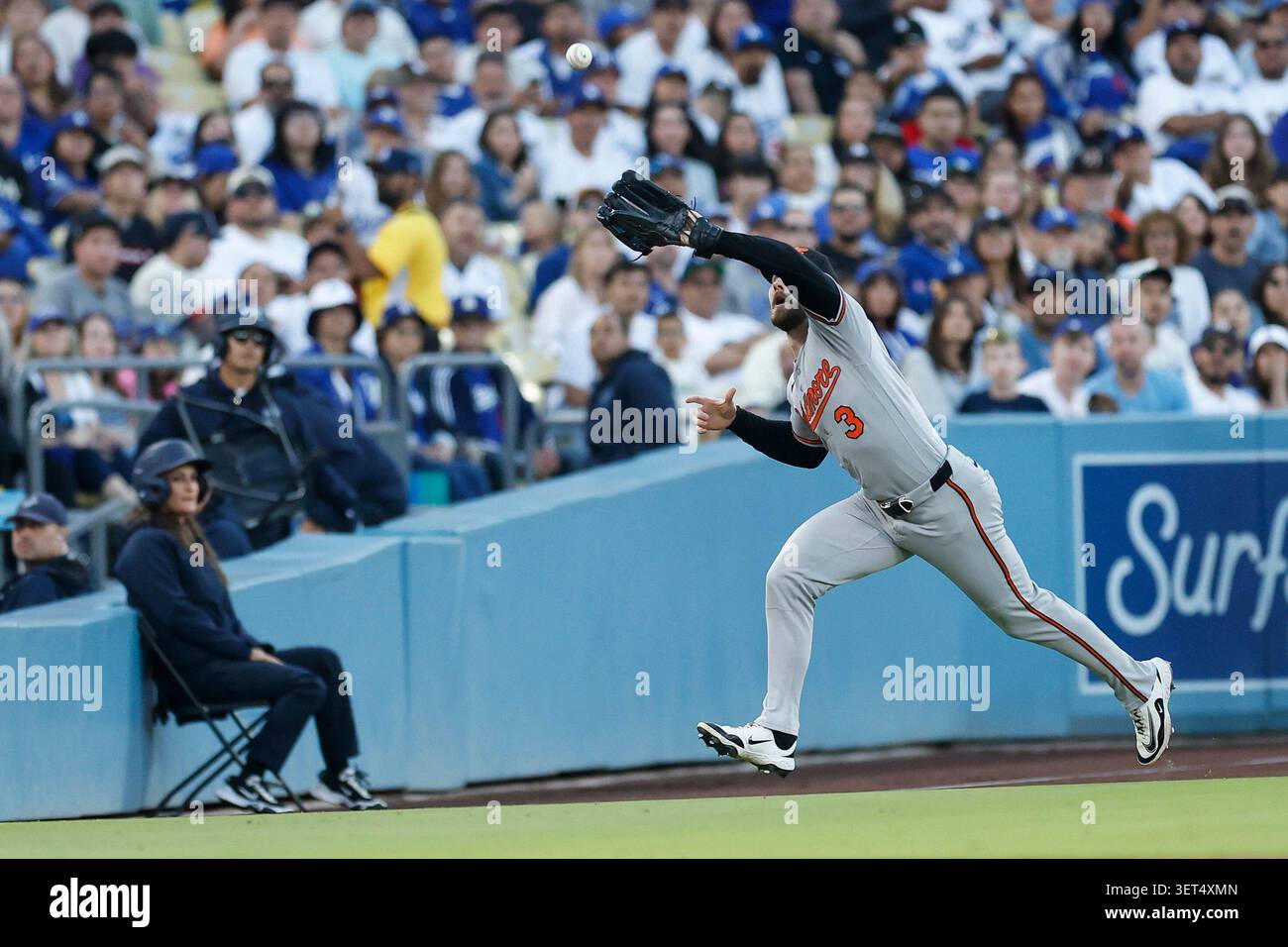 Baltimore Orioles left fielder Taylor Ward (3) runs to catch a fly ball ...