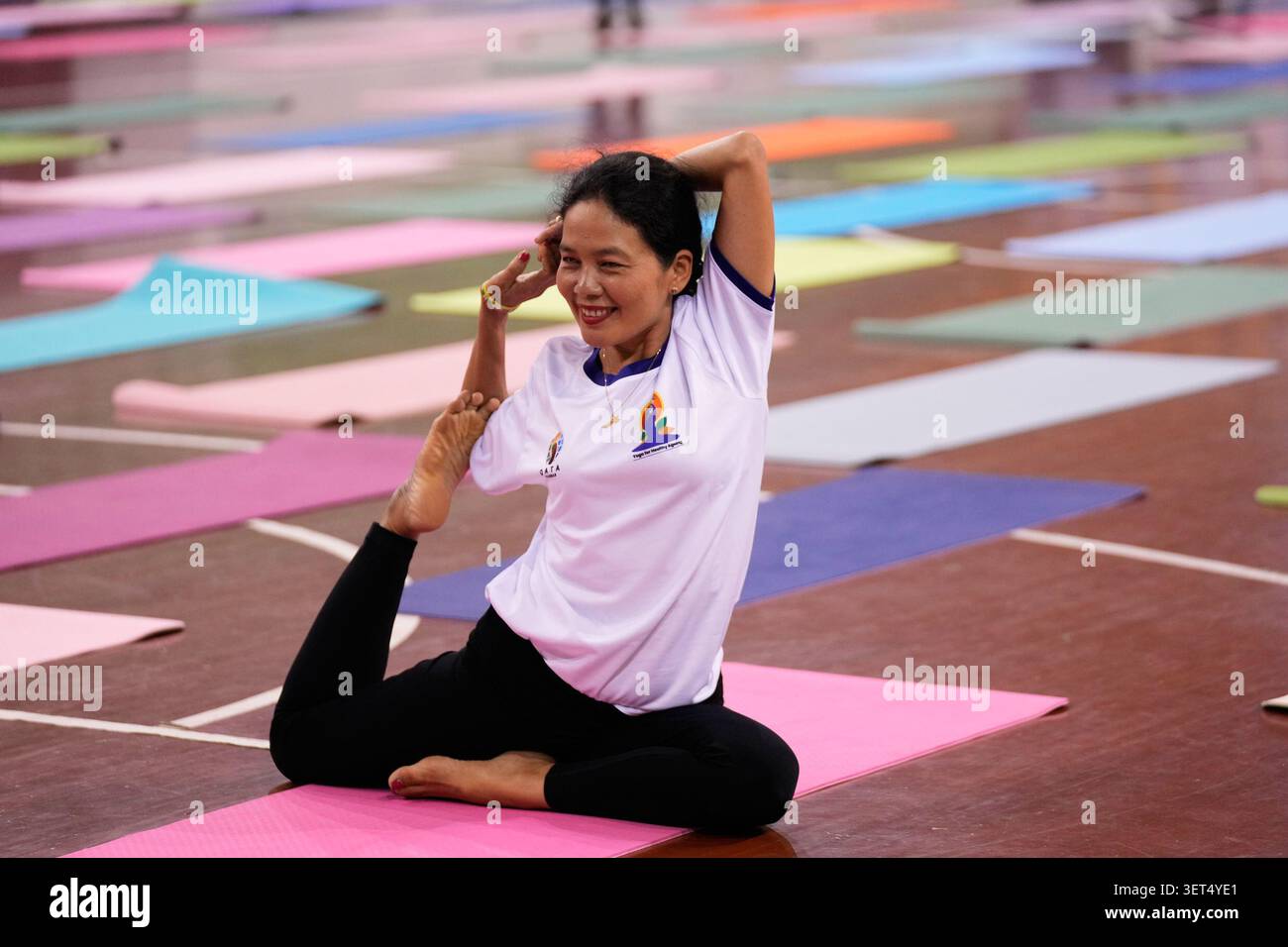 Yoga enthusiast pose for photo as they take part in mass yoga programs ...