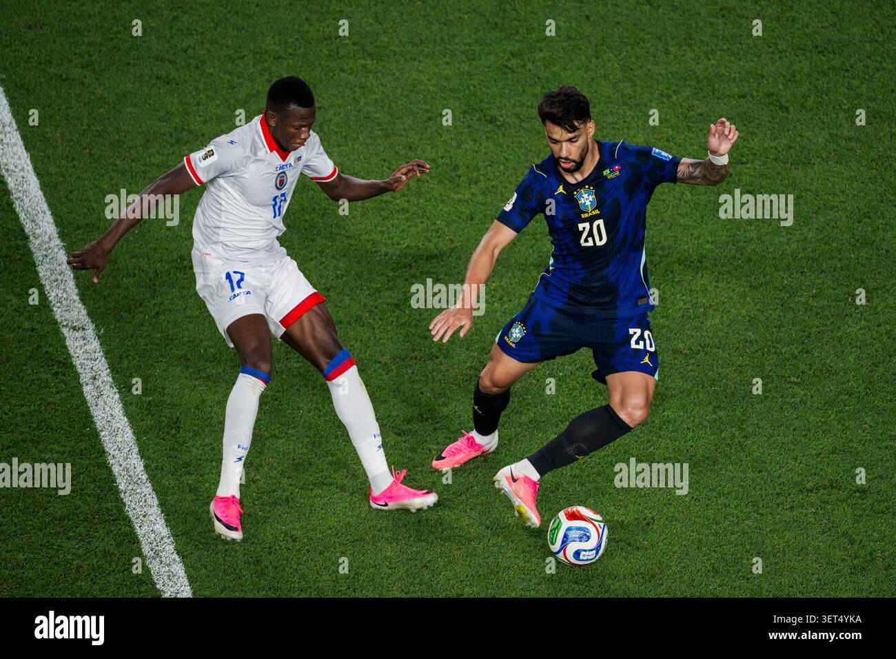 Lucas Paqueta of Brazil comeptes for the ball with Danley Jean Jacques ...