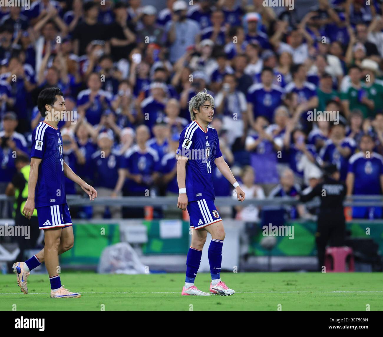 Junya Ito (14) of Japan reacts after scoring in the second half of 2026 ...