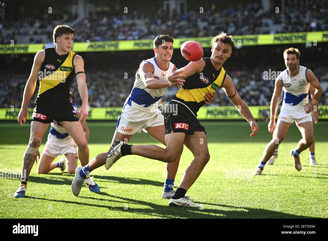 Harry Sheezel of North Melbourne tackles Taj Hotton of Richmond during ...