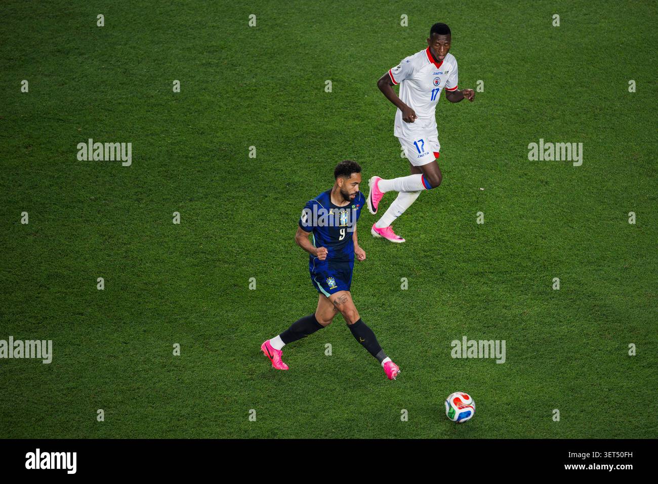 Matheus Cunha of Brazil is challenged by Danley Jean Jacques of Haiti ...