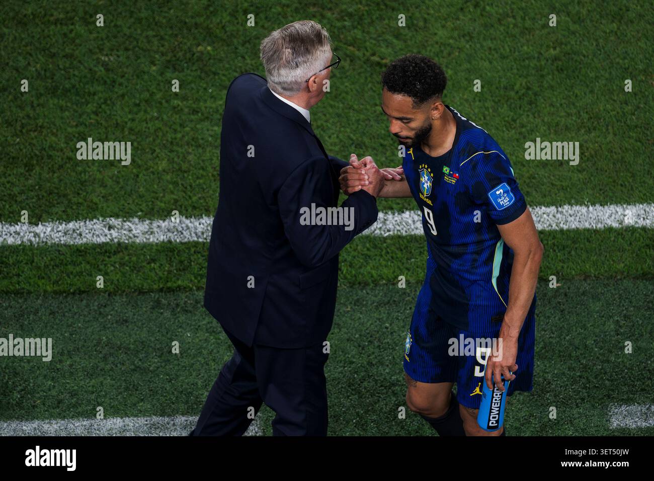 Matheus Cunha of Brazil shakes hands with Carlo Ancelotti, head coach ...