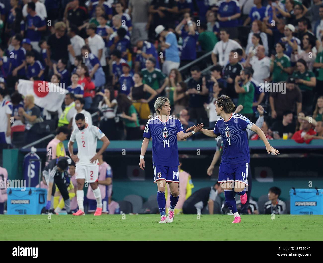 Junya Ito (14) of Japan reacts after scoring in the second half of 2026 ...