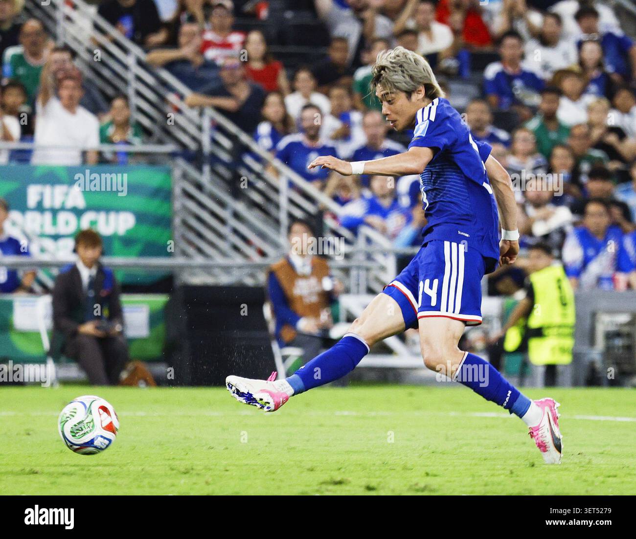 Japan's Junya Ito scores the team's third goal in the second half of a ...