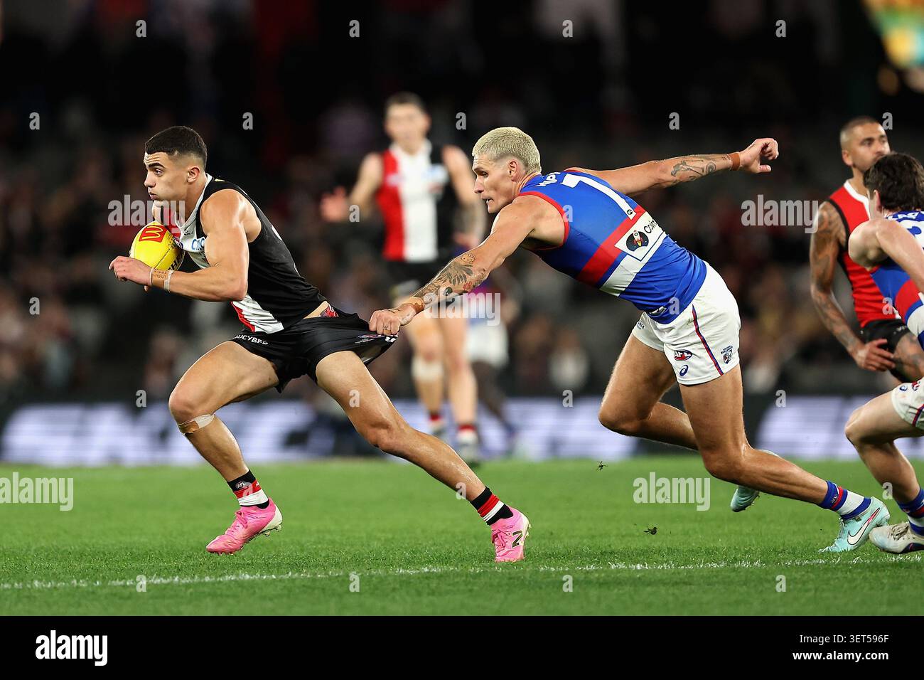 Hugo Garcia of the Saints runs with the ball during the AFL Round 15 ...