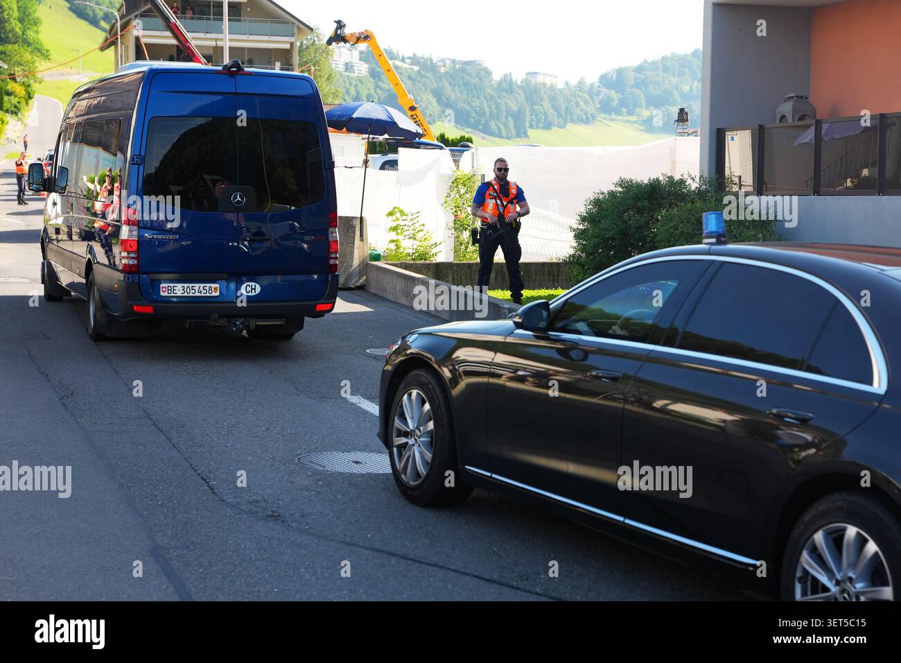 A police officer observes as motorcade carrying the Pakistani ...