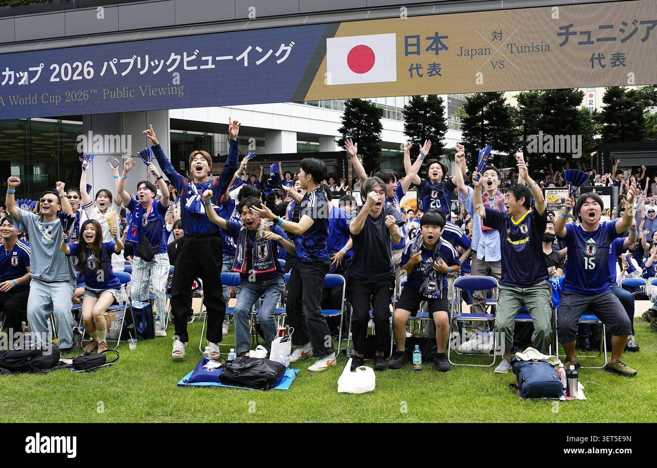 Japan supporters celebrate during a public viewing in Tokyo on June 21 ...