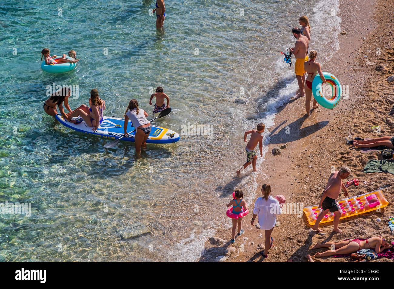 People enjoying the beach at Banje beach at the start of summer season ...