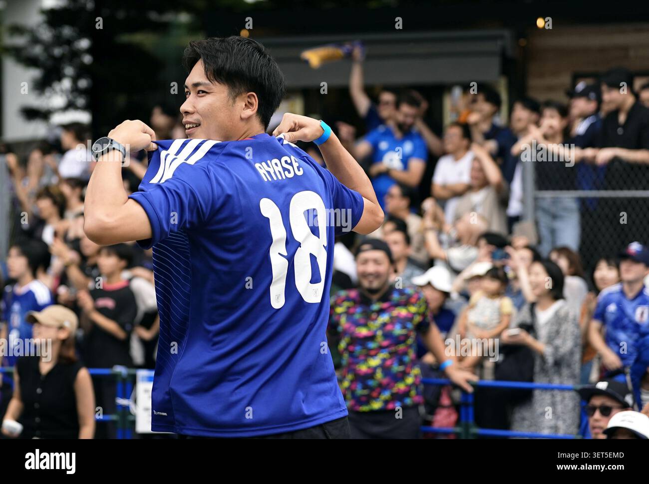 Japan supporters celebrate during a public viewing in Tokyo on June 21 ...