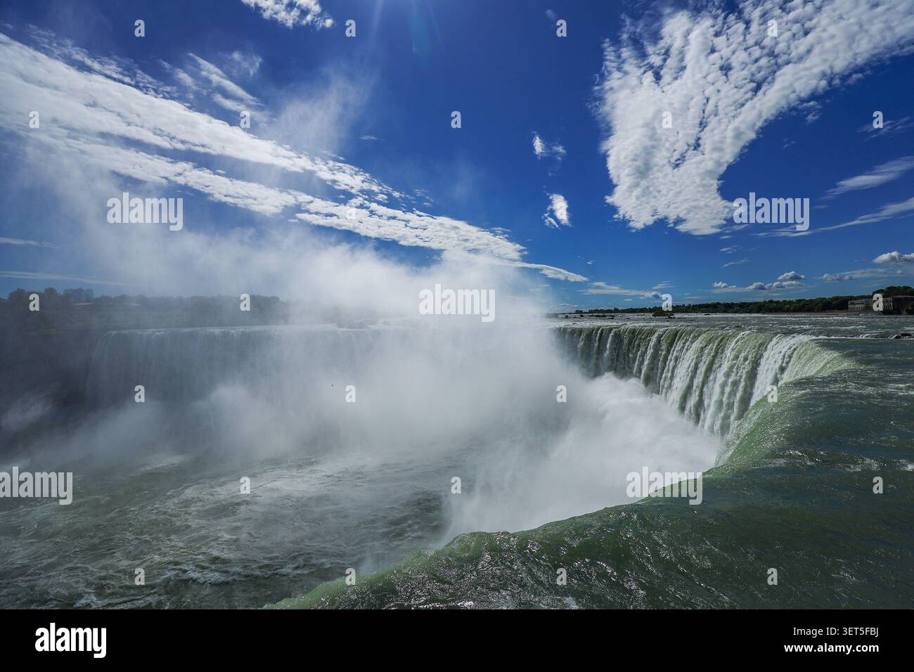 Tourists observe American Falls along the parapet wall on June 20, 2026 ...