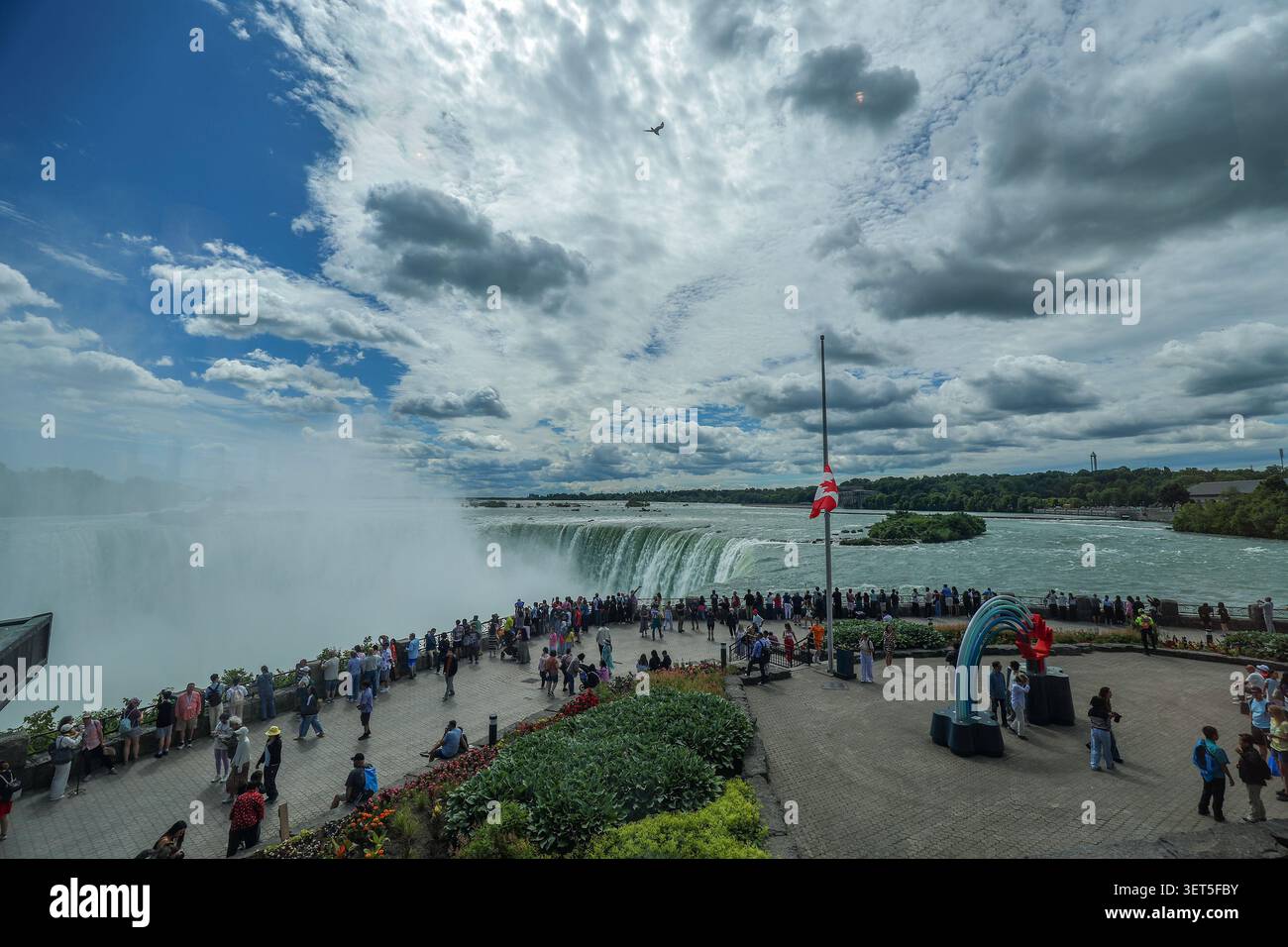 Tourists observe American Falls along the parapet wall on June 20, 2026 ...