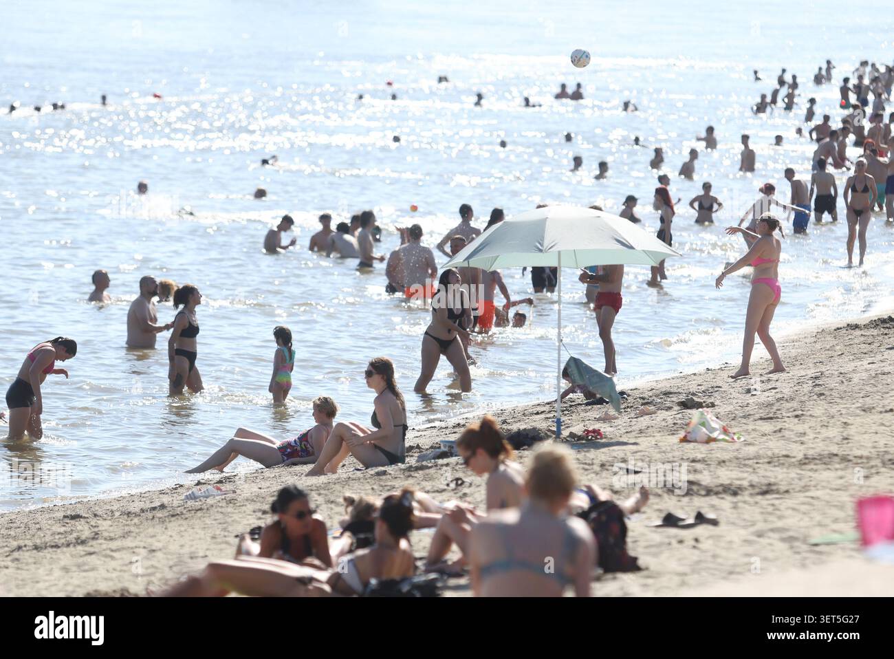 People enjoying the beach at Kopika beach at the start of summer season ...