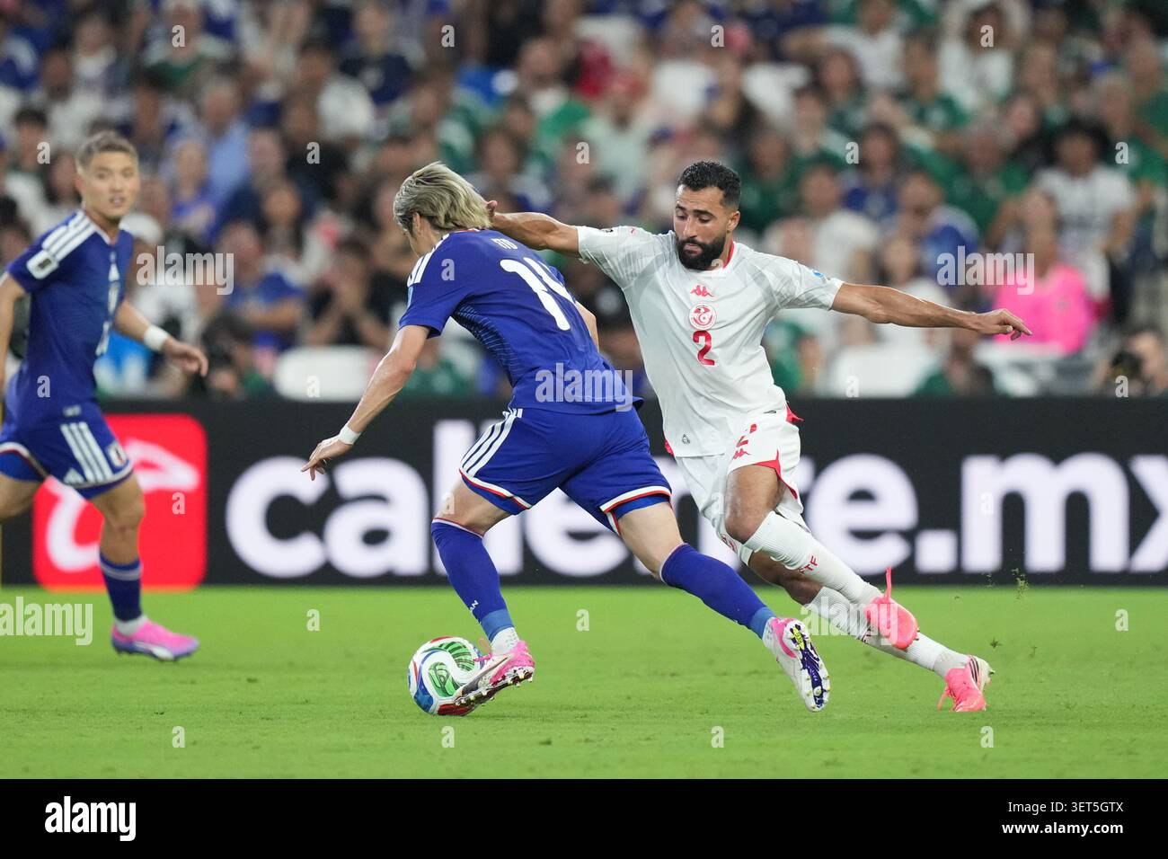 Ali ABDI of Tunisia and Junya Ito of Japan during the FIFA World Cup ...
