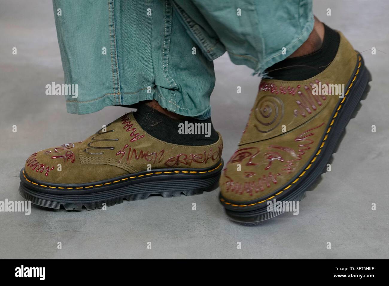 A model wears a creation as part of the Simon Cracker Spring/Summer ...